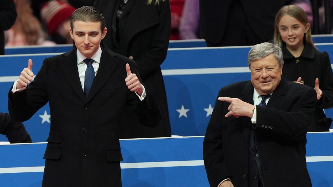Who is the man sitting next to Barron Trump at the inauguration? | wtsp.com
