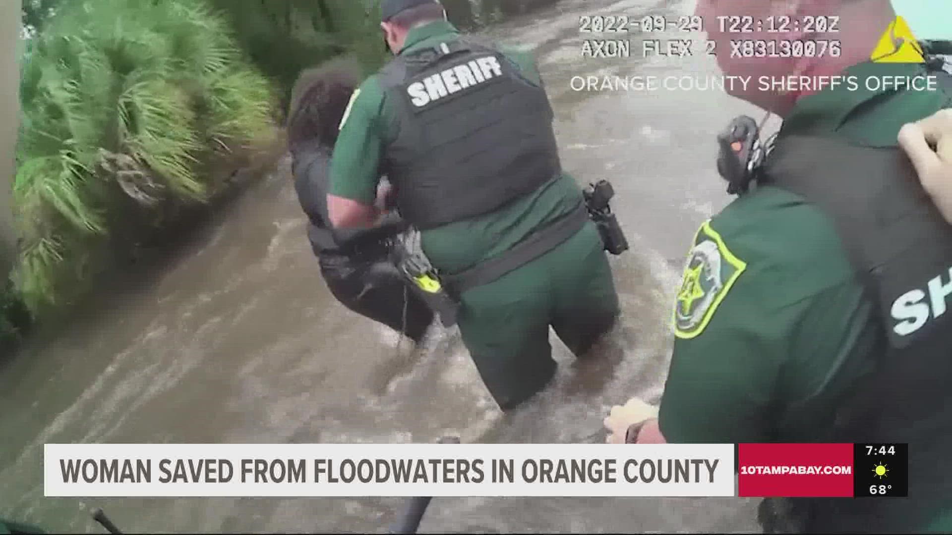 Video: Woman rescued from 10-foot deep floodwaters in Orange County ...