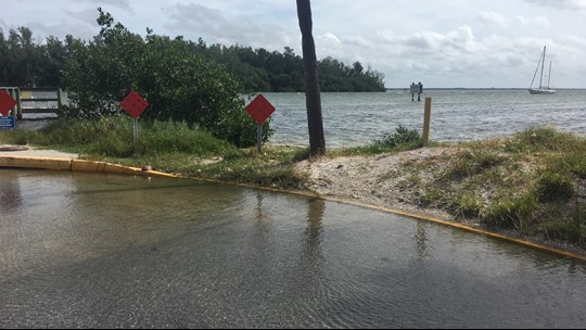 Photos: High tide and storm surge causes flooding in Longboat Key, St ...