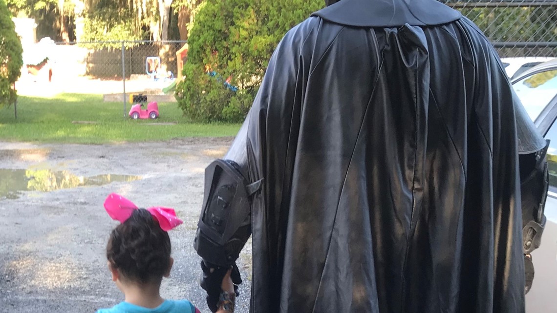 Batman walks toddler to school after she was bullied | wtsp.com