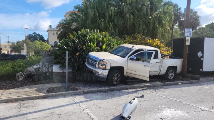 Truck Loses Control Ends Up Lodged Against Wall In Clearwater