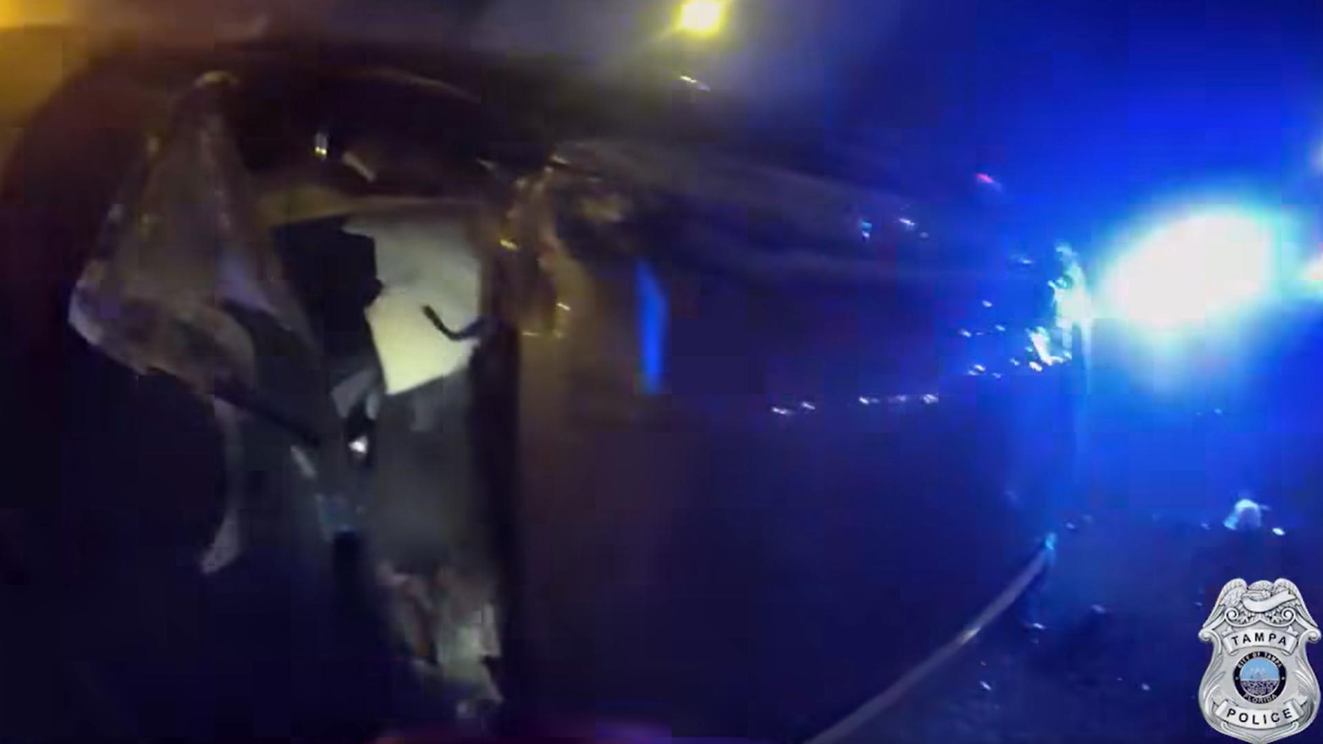 WATCH: Tampa police rescue woman from car flipped over, on fire | wtsp.com