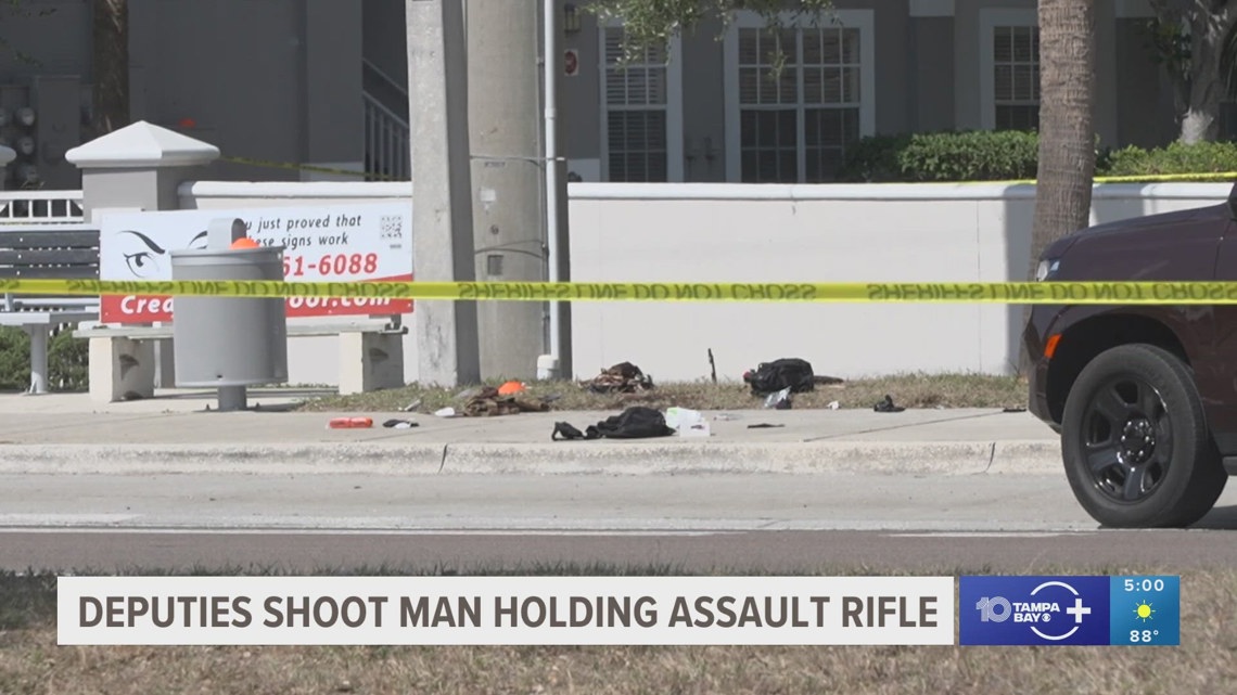 HCSO: Man carrying 'fully loaded' assault rifle shot, killed by ...