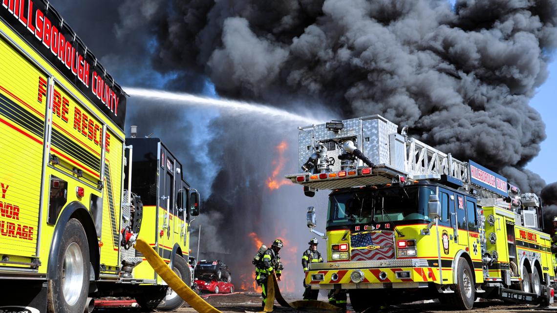 Hillsborough County crews contain 2-alarm fire at Tampa auto salvage ...