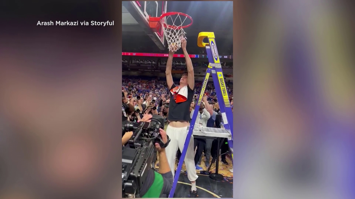 Gators basketball player cuts down piece of net without ladder | wtsp.com