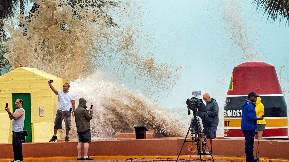 People pose for pics at Southernmost Point buoy during hurricane | wtsp.com