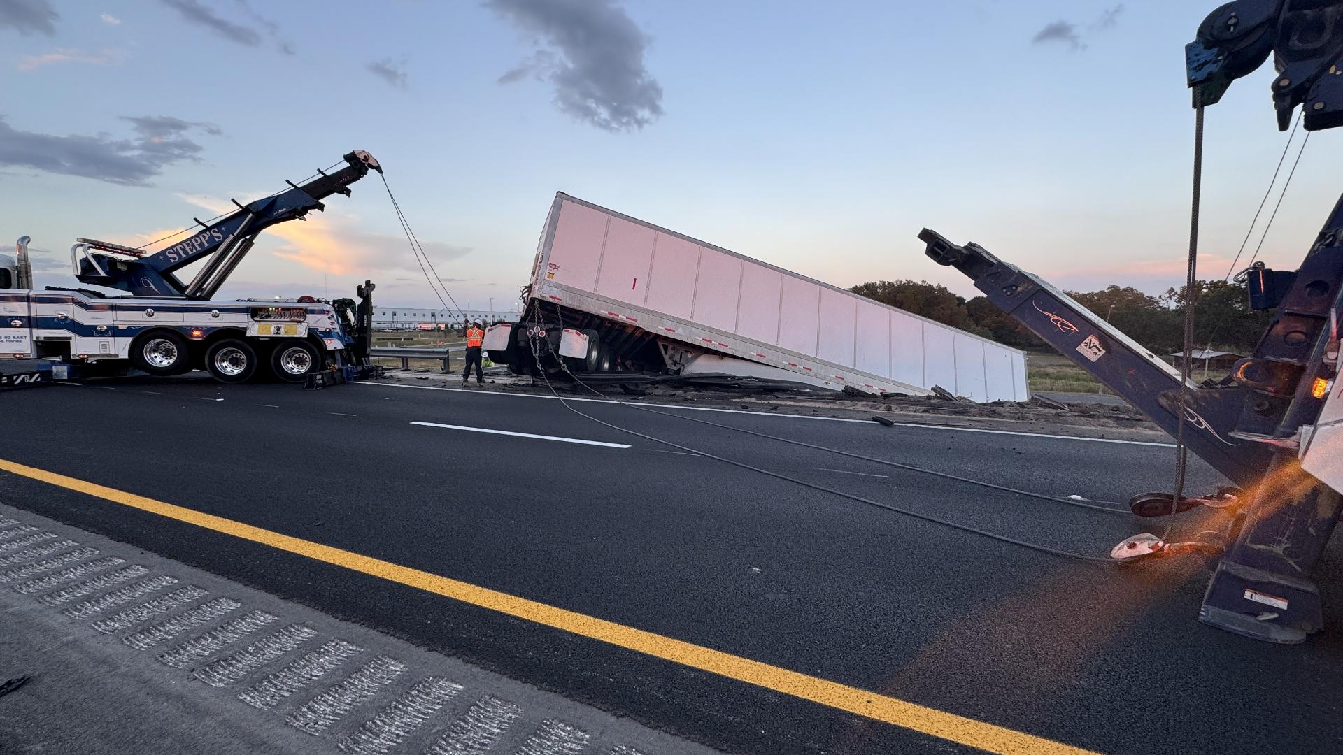 Semi-truck hanging off overpass on Polk Parkway East | wtsp.com
