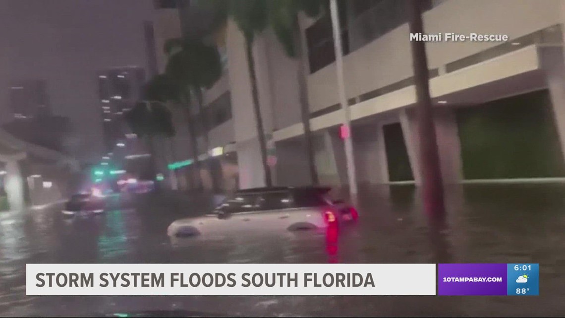 People climb out of sunroofs as cars get stuck in Miami flood waters ...